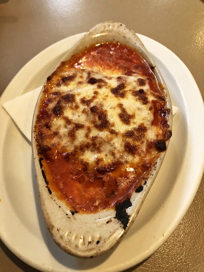 Lasagna that's achieved the perfect cheese-pull-to-sauce ratio. It's architecture you can eat, with layers that would make a geologist weep with joy.