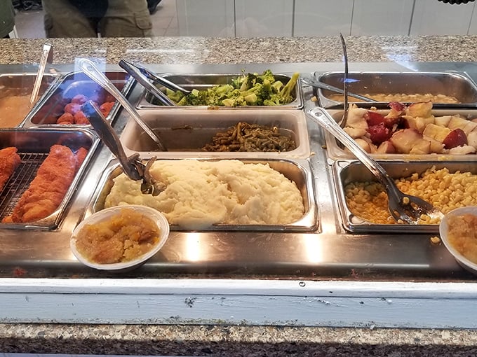 The buffet line reveals the treasure everyone's talking about—those famous mashed potatoes holding court among a supporting cast of Southern sides.