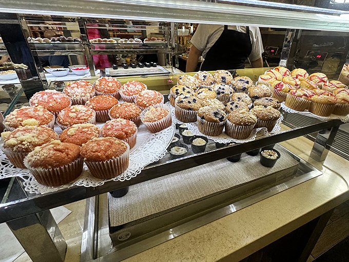 Muffin mountain! These golden-topped beauties stand in formation like delicious soldiers, each one promising a different sweet surrender to your taste buds.