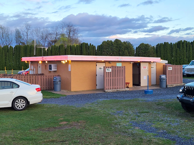 Families set up camp before showtime, complete with tents and inflatable play areas&mdash;proving drive-ins were the original entertainment multitaskers. 