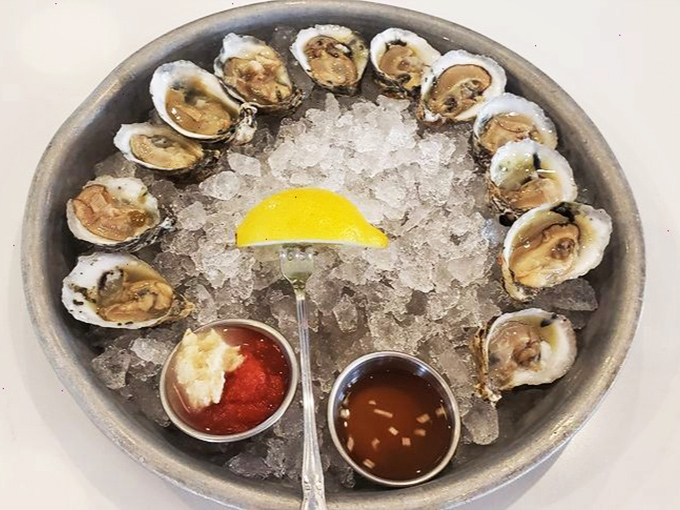 A dozen glistening oysters arranged like a clock face&mdash;nature's perfect appetizer, requiring nothing more than a squeeze of lemon and good company.