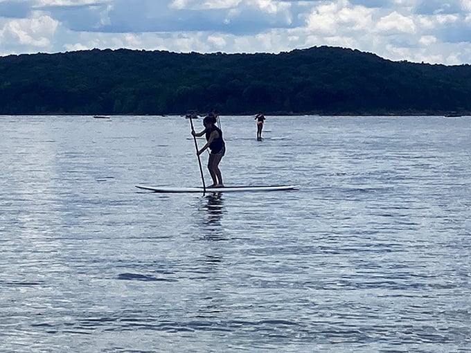 Paddleboarding: that rare activity where looking slightly unsteady is part of the charm—Lake Monroe's gentle waters perfect for beginners.