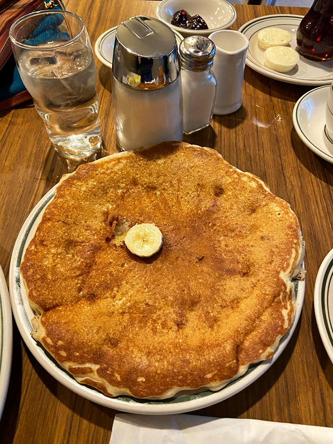 The pancake that launched a thousand return visits&mdash;wider than your plate, golden as a summer sunset, with butter melting into its warm embrace.