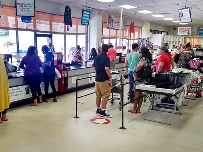 The checkout line: where strangers become temporary comrades united by the universal language of "Can you believe what I found for only this much?"