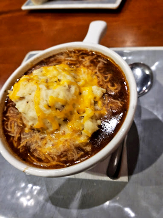 The Irish stew arrives like a warm hug in a bowl, with that perfect cheese-to-potato ratio that would make any Irish grandmother nod in approval.