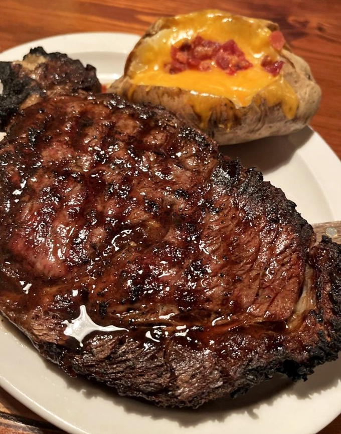 A prime rib that could make vegetarians question their life choices, paired with a loaded baked potato that's practically a meal itself.