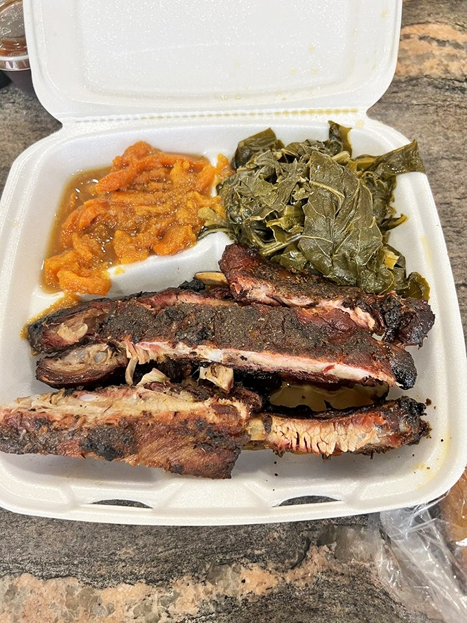 This pulled pork sandwich isn't just a meal, it's an event. The sauce-soaked meat spilling over that soft bun is begging you to abandon all dignity. 