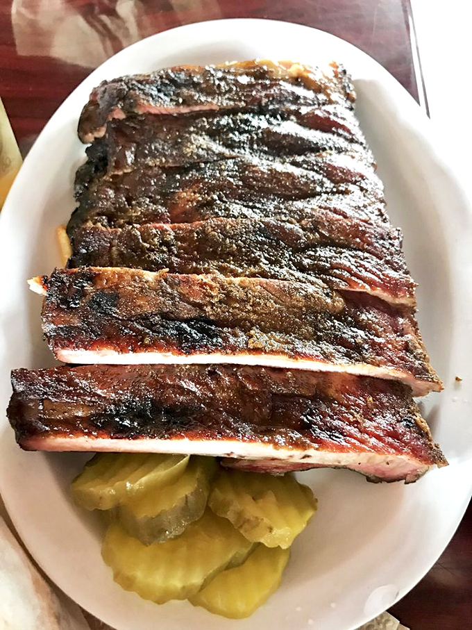 These ribs aren't falling off the bone&mdash;they're clinging to it with dignity. The perfect resistance when you bite, then surrender with smoky grace.