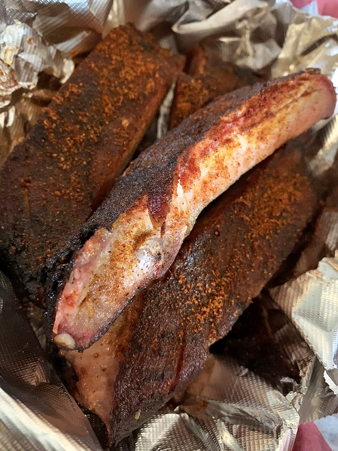 These ribs aren't falling off the bone&mdash;they're clinging to it with just enough resistance to remind you that proper barbecue requires a little work.
