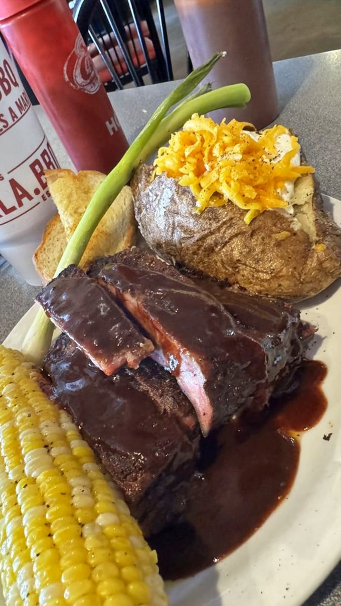 When your ribs come with a loaded baked potato and corn, it's not a meal&mdash;it's a declaration that vegetables can join the party too.