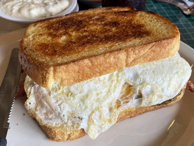 This breakfast sandwich isn't messing around. With eggs this perfectly cooked, your morning just went from "good" to "why yes, I would like to climb a mountain today."