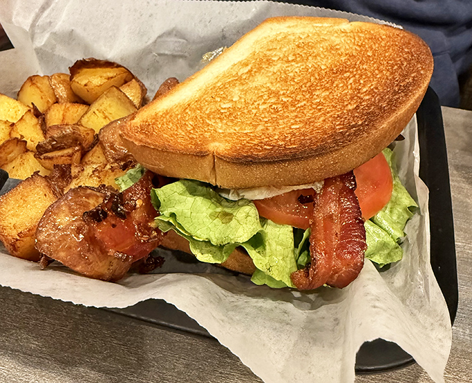 A sandwich so photogenic it could have its own Instagram account. Those home fries are the perfect supporting cast.