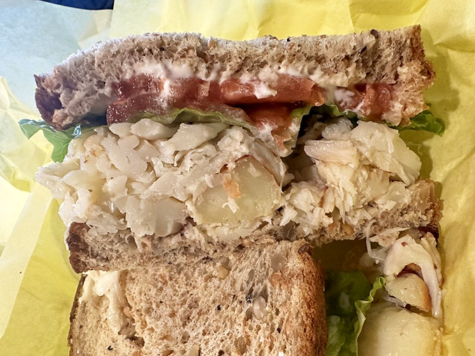 Architecture matters in sandwiches too. This perfect ratio of crab to bread to fresh veggies creates the structural integrity needed for maximum flavor delivery. 
