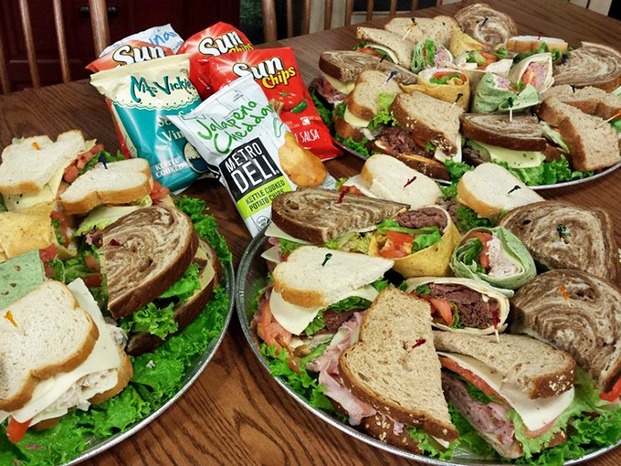 Sandwich platters that make corporate catering trays weep with inadequacy. The kind of spread that turns regular meetings into "productive discussions."