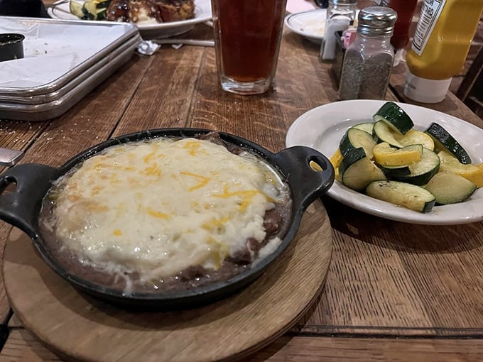 A perfect marriage: shepherd's pie with its molten interior and golden top alongside fresh zucchini that pretends this meal has nutritional balance.