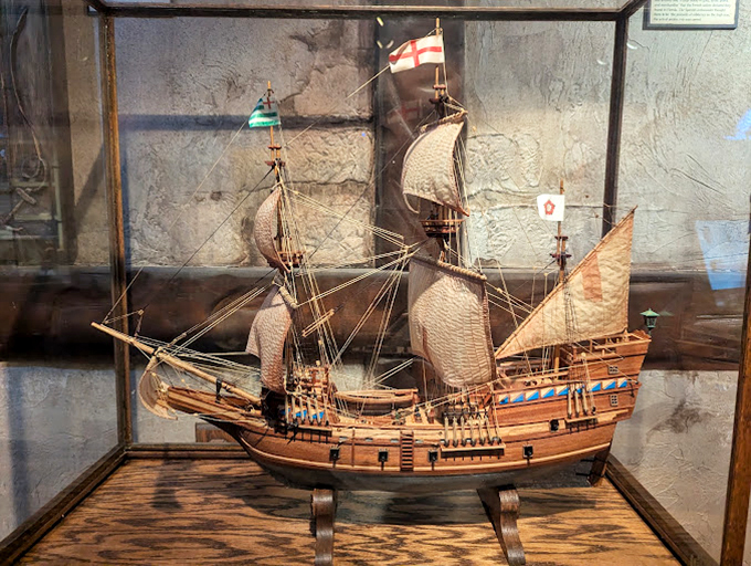 Naval craftsmanship in miniature. This model ship showcases the intricate design of vessels that once carried both legitimate cargo and pirate plunder.