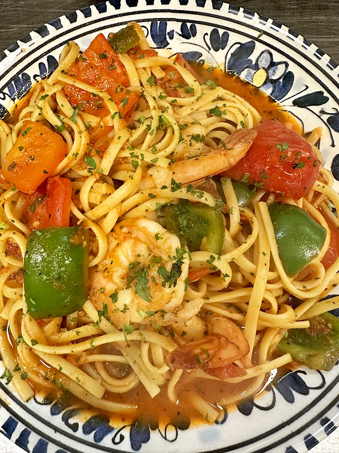 Shrimp linguine that's having a party and invited all the right guests: plump shrimp, colorful peppers, and pasta cooked to textbook al dente.