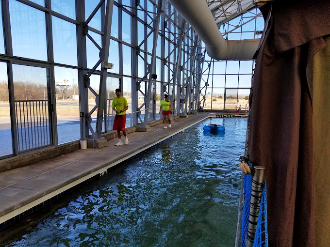 The glass walls create that perfect "I'm swimming in sunshine" feeling, even when there's six inches of snow outside. Oklahoma weather doesn't get a vote in here.