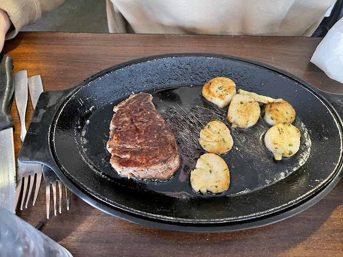 Surf meets turf in this drama-free relationship &ndash; a juicy steak sharing the spotlight with buttery scallops that practically leap onto your fork.