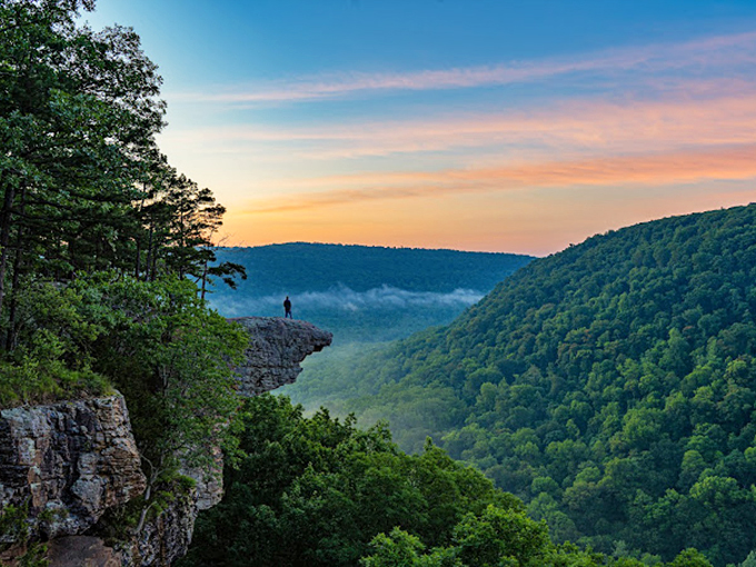 Sunrise seekers are rewarded with this ethereal moment&mdash;one person, one crag, and a valley full of possibilities wrapped in golden morning light.
