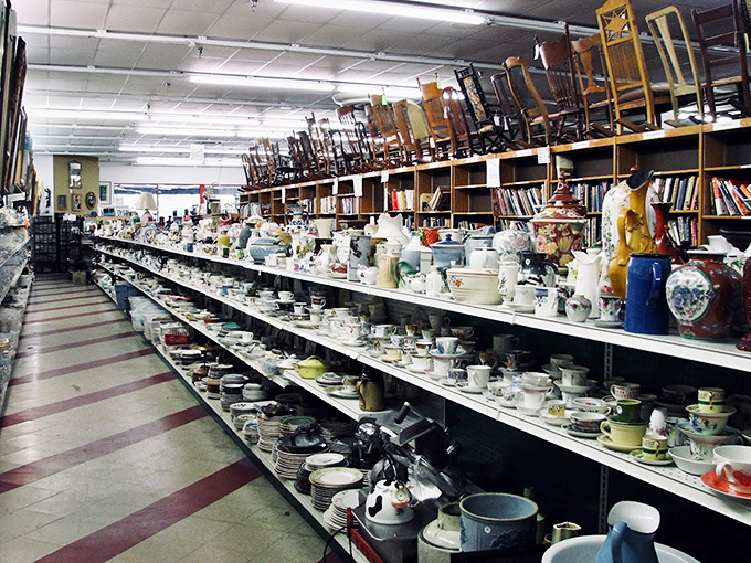 Teacups and saucers that have survived countless Sunday gatherings wait patiently for their next chance to serve, arranged in an archaeological layer cake of ceramics.