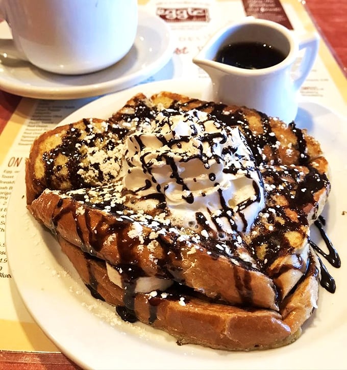 Brioche French toast drizzled with chocolate and topped with whipped cream &ndash; because sometimes breakfast should double as dessert without any apologies.