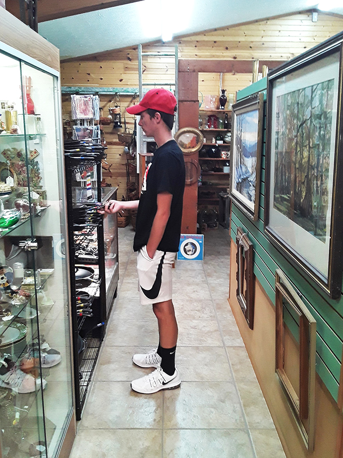 The narrow pathways between vendor booths create an intimate treasure-hunting experience. Even teenagers, normally glued to screens, find themselves captivated by tangible history.