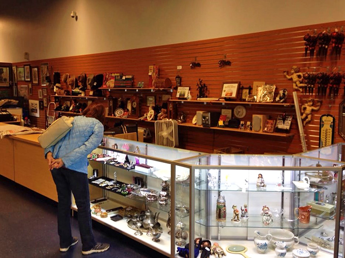 The collectibles section showcases everything from delicate figurines to vintage treasures. Each glass case holds someone's future conversation piece waiting to be discovered.