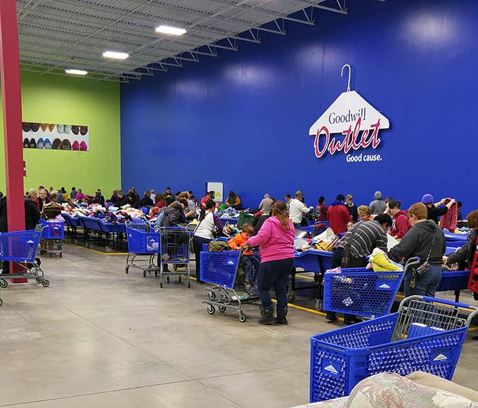 The blue bin ballet in full swing&mdash;shoppers strategically positioned like chess masters, each waiting for the perfect moment to make their move.