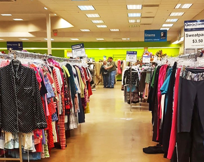 The clothing aisles create a retail labyrinth where shoppers navigate between possibilities, hunting for that perfect find among the color-coded racks.