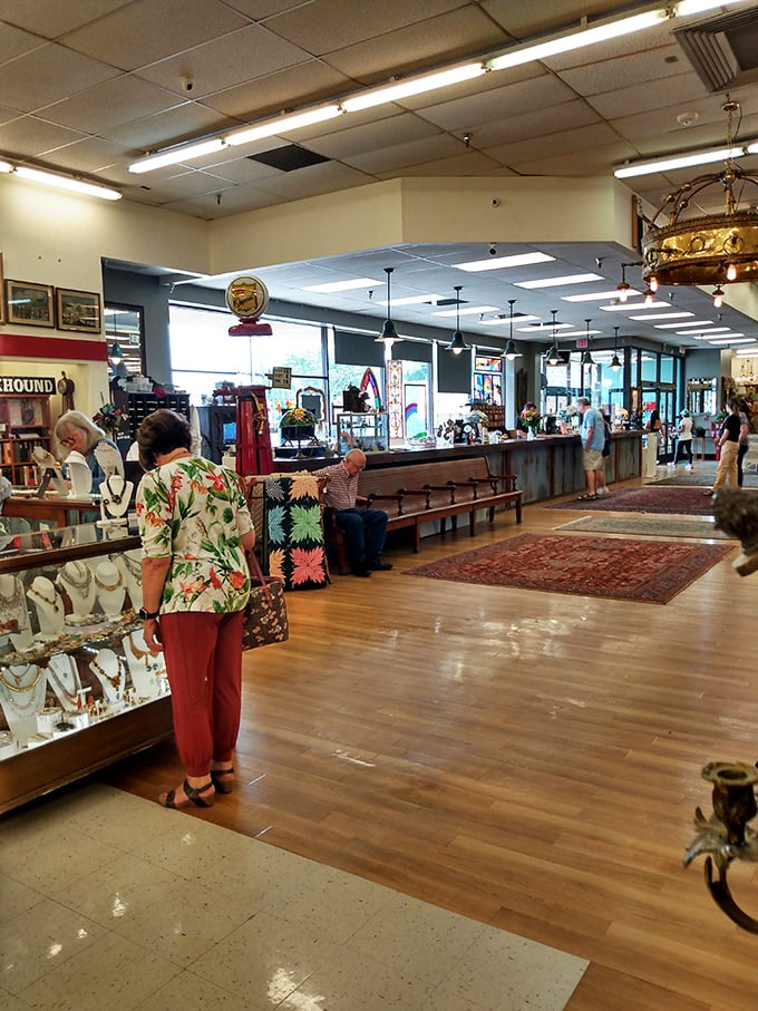 Treasure hunters of all ages wander the polished floors, each on their own quest. That Hawaiian shirt gentleman might just be eyeing the same mid-century lamp you've been stalking.