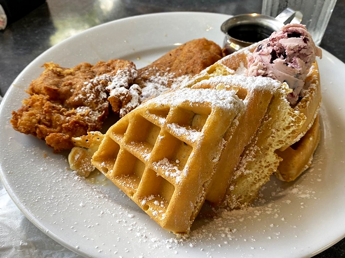 The breakfast trifecta: golden waffles, crispy chicken, and what appears to be berry ice cream - because who said you can't have dessert at 9 AM?