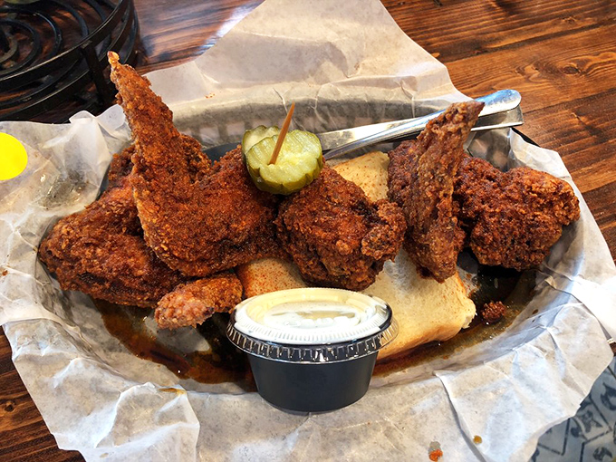 These fiery wings aren't just spicy, they're conversation-stoppers. That pickle in the middle? The perfect cool-down between bites of heavenly heat.