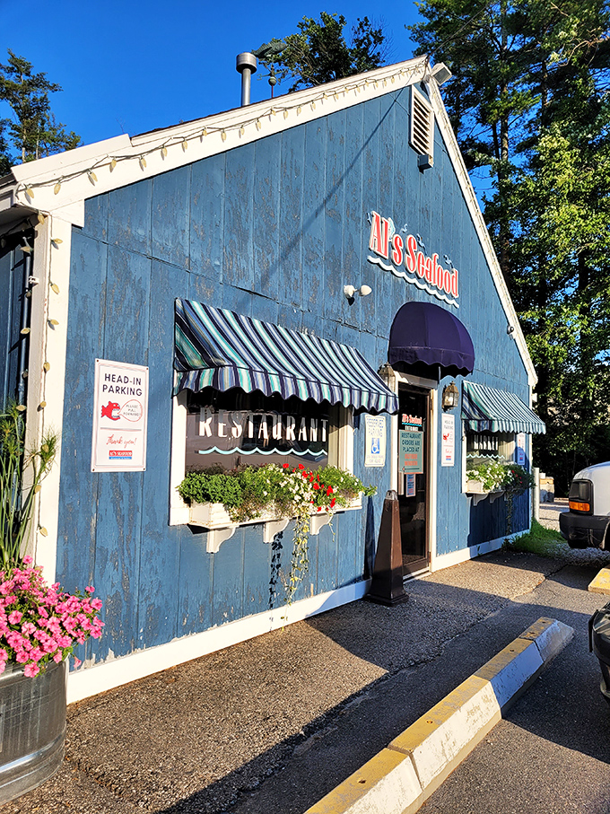 Al's weathered blue exterior tells a story of countless seafood feasts and happy customers over decades of service.