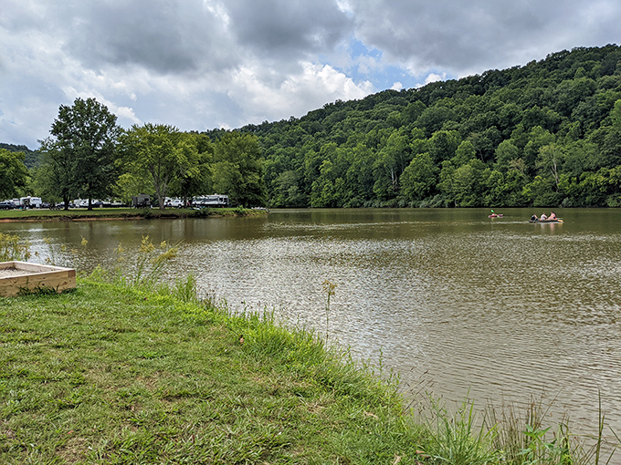 Beech Fork Lake shimmers under cloudy skies, a peaceful oasis where fishing stories are born daily.