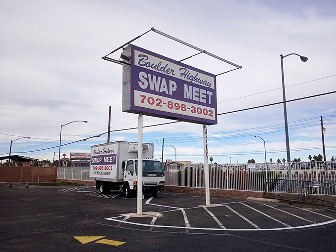 The Boulder Highway Swap Meet sign stands tall against the sky, a beacon for the deal-obsessed.