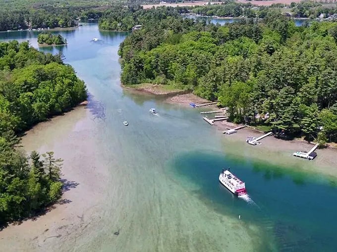 Waupaca's Chain O' Lakes offers a water playground where boats create white ribbons across the blue canvas of connected waterways.