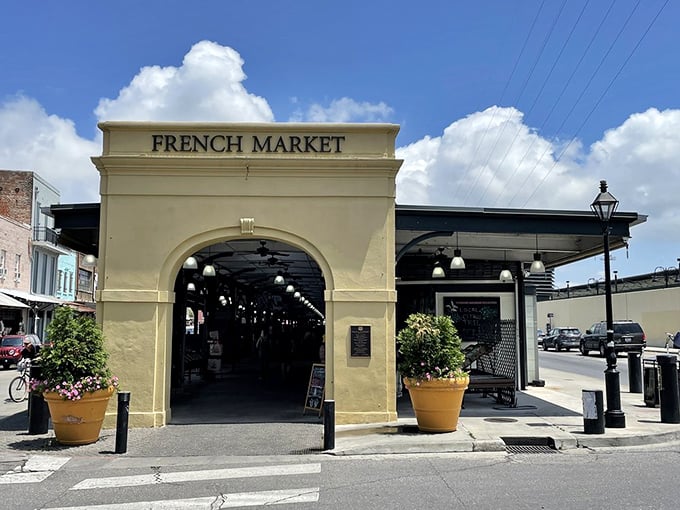 The French Market's historic archway has welcomed bargain hunters and food lovers for centuries—like a time portal to Old New Orleans.