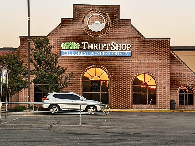 Brick fa&ccedil;ade meets elegant arch windows at Hillcrest Thrift Shop. It's like Downton Abbey decided to open a second-hand store!