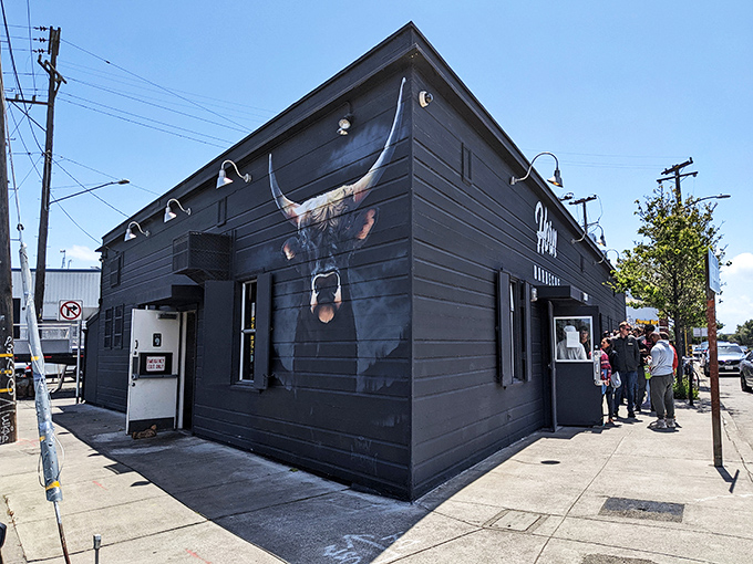 Horn Barbecue: Dramatic black exterior, dramatic flavors inside. That bull silhouette promises a serious meat experience.