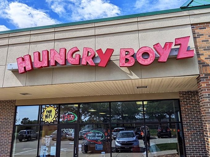 Hungry Boyz's bold red signage makes a promise that their overstuffed subs enthusiastically fulfill.