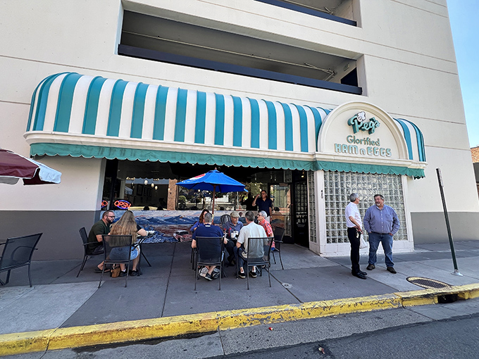 Peg's Glorified Ham n Eggs (Exterior): That blue-striped awning signals breakfast bliss &ndash; Peg's outdoor seating turns morning meals into social events.