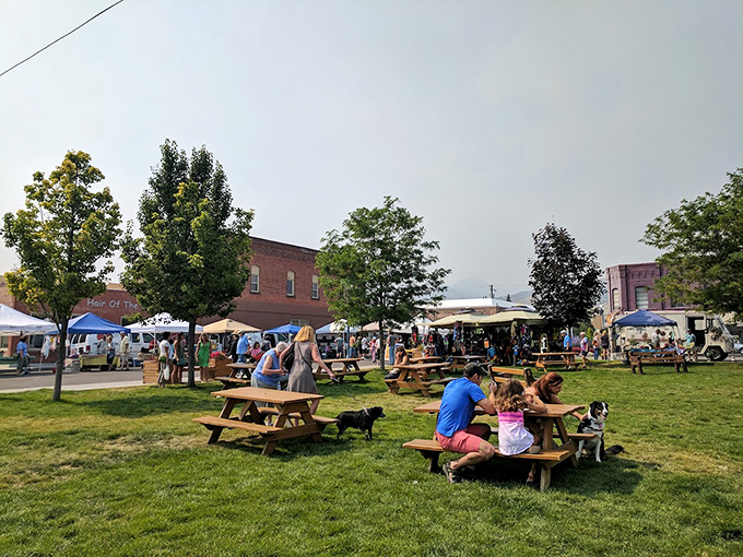 Park picnic tables invite market-goers to turn shopping into an all-day social affair. Your grocery list has never been this much fun!