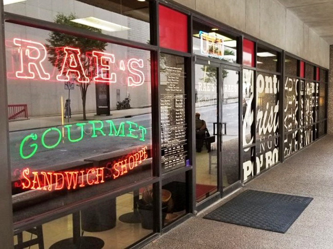 Rae's neon sign glows like a lighthouse guiding hungry souls through the stormy seas of mediocre lunch options.