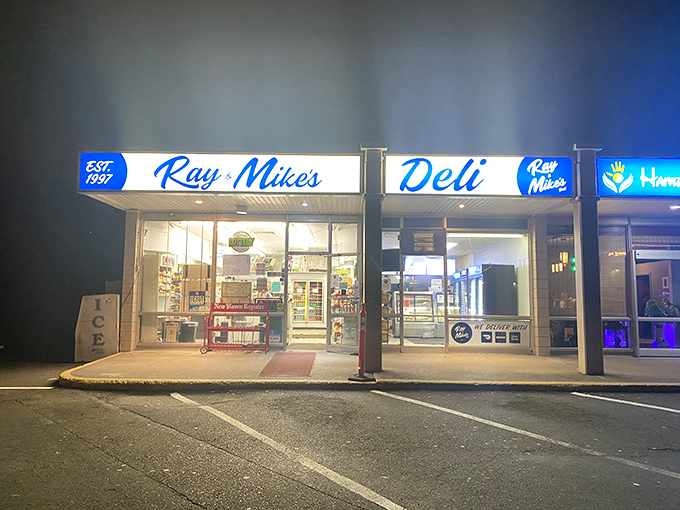 Ray & Mike's after dark&mdash;a beacon of late-night sandwich hope. When the blue sign glows, hunger doesn't stand a chance.