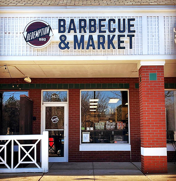 Redemption BBQ's clean brick storefront might look modest, but inside they're saving souls one perfect rib at a time.