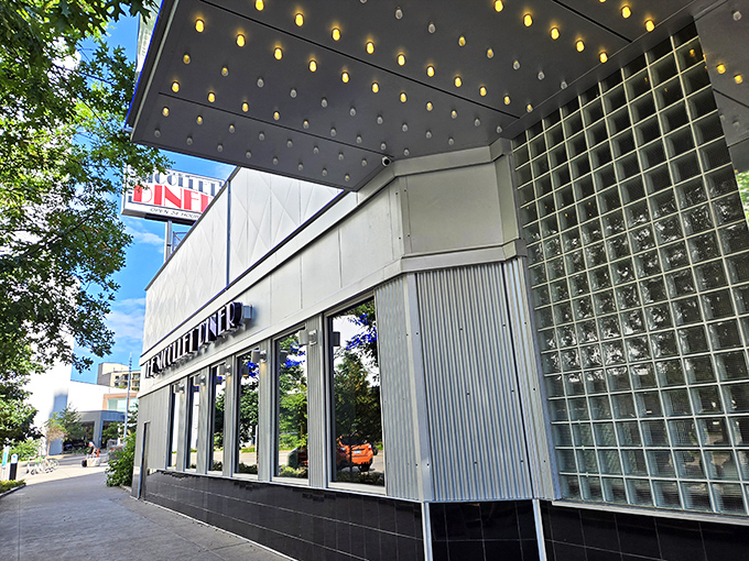 The Nicollet Diner's modern facade hides old-school breakfast wisdom - where city lights meet perfectly golden toast at any hour.
