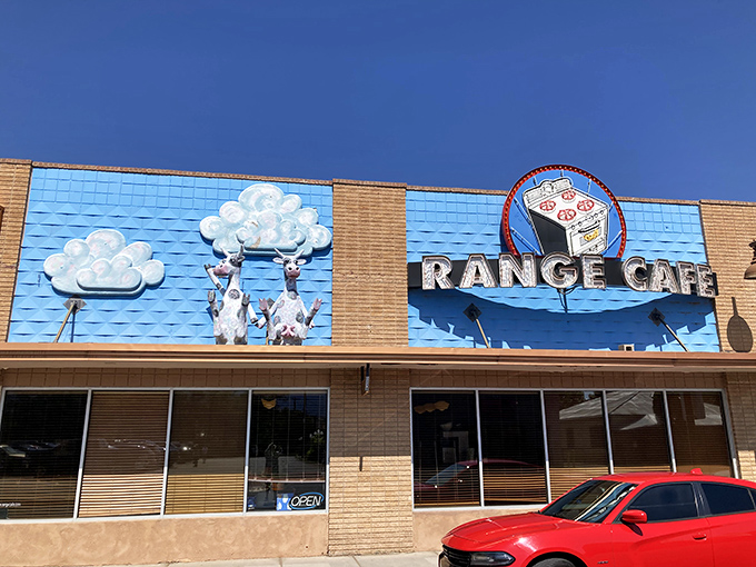 The Range Cafe's playful blue facade with whimsical cow art says, "We don't take ourselves seriously - just our pancakes!"