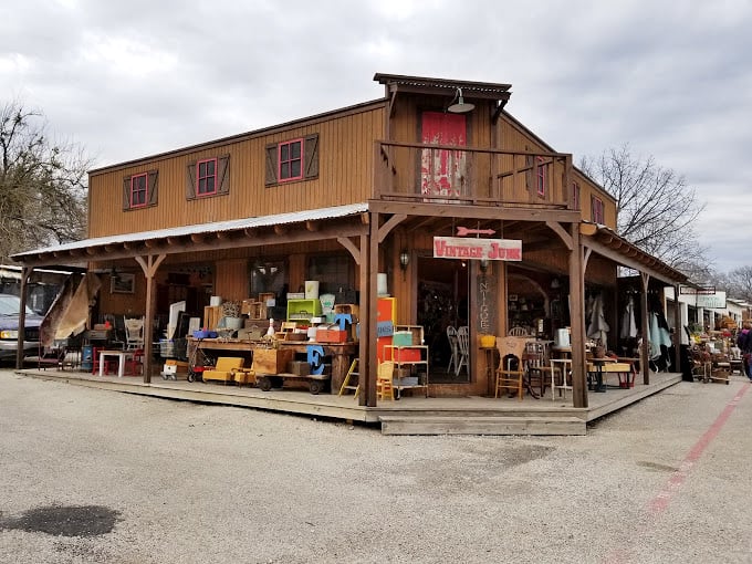 Old West charm meets treasure hunter's paradise! This rustic wooden storefront looks like it belongs on a Hollywood movie set.