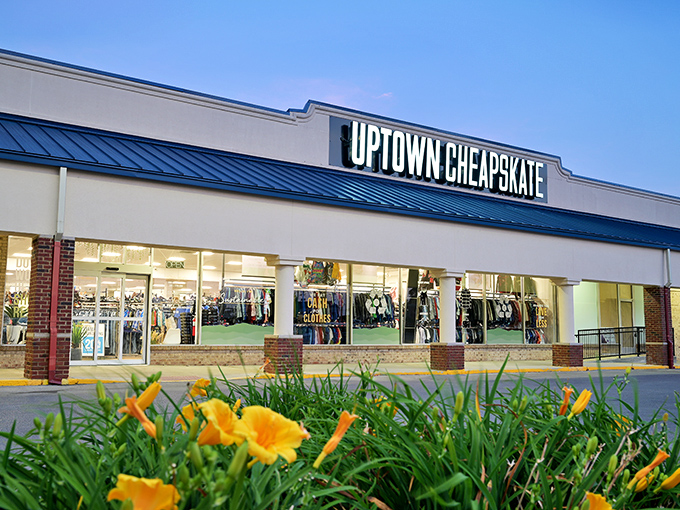 Uptown Cheapskate's sleek storefront and vibrant flower display create a boutique feel for this budget-friendly fashion stop.